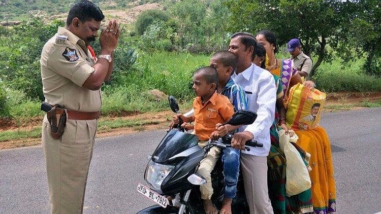 Behind the Viral Photo of an Andhra Cop Pleading with a Family