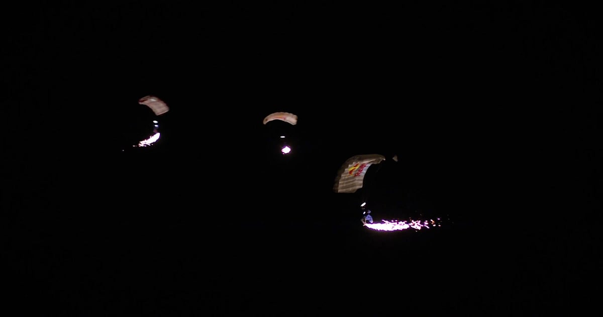 These Skydivers Are Lighting up the Night Sky With Their Wingsuits