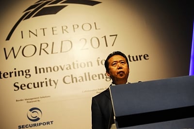 China says ex-Chinese Interpol chief took bribe, under probe