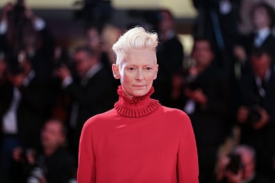 Swinton makes rare appearance with beau