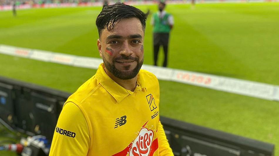 Afghanistan Cricketer Rashid Khan Sports Country's Flag While Playing ...