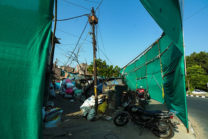 In Photos | 'Ashamed of Poverty': Green Sheets Mask Delhi Slums Ahead ...
